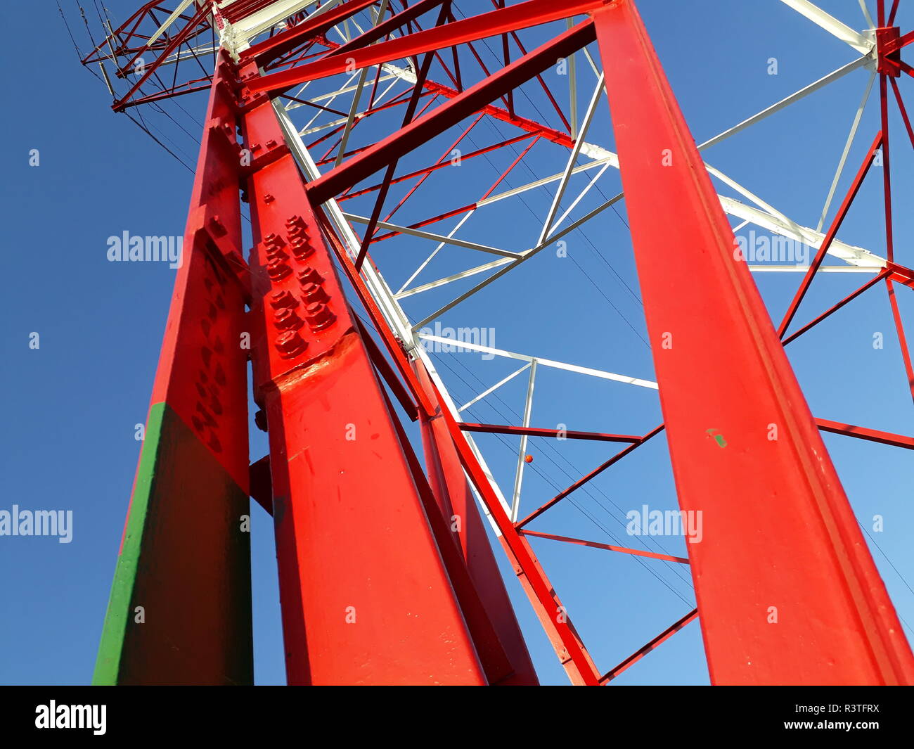 Detail of high voltage towers painted red on top of a mountain Stock ...