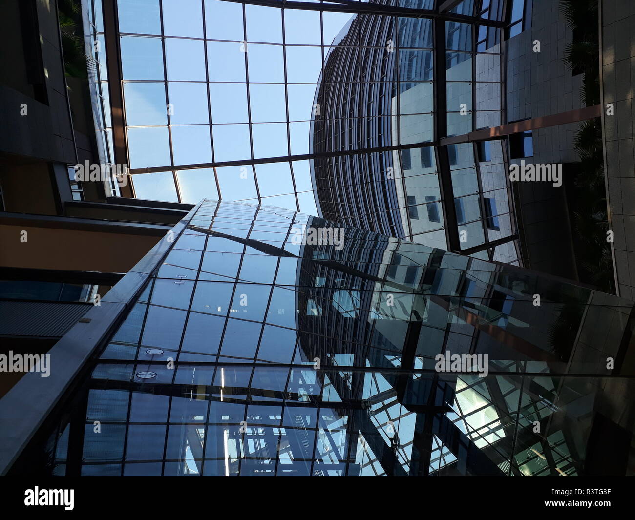 Blue reflections on the panes of an office building, business ...