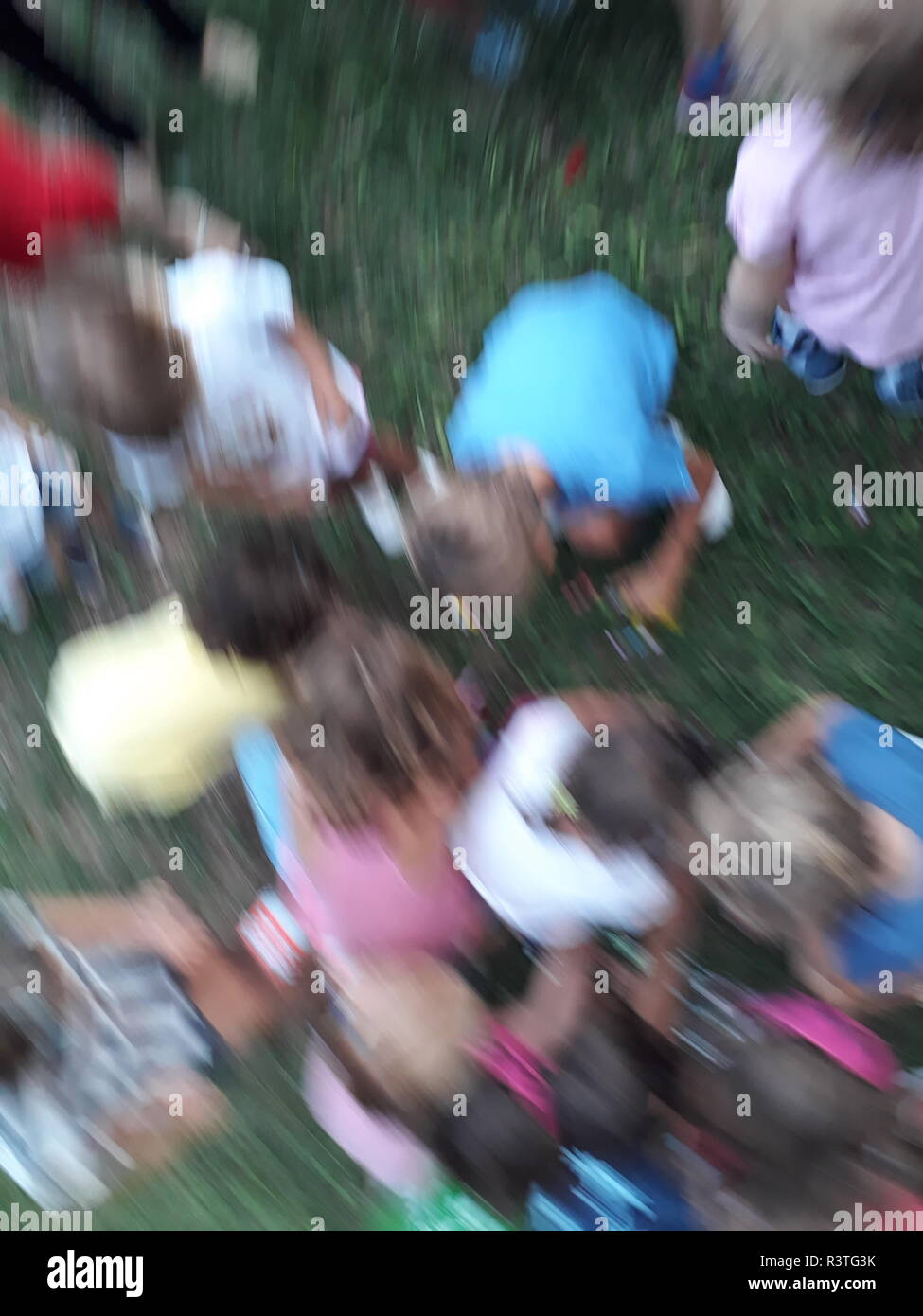 Blurred and defocused photograph of group of children as concept of ...