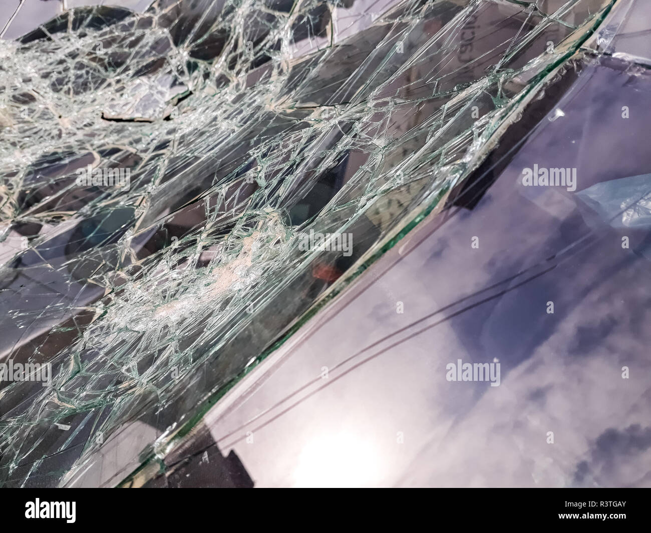 Broken windshield of abandoned and destroyed car, with broken glass ...