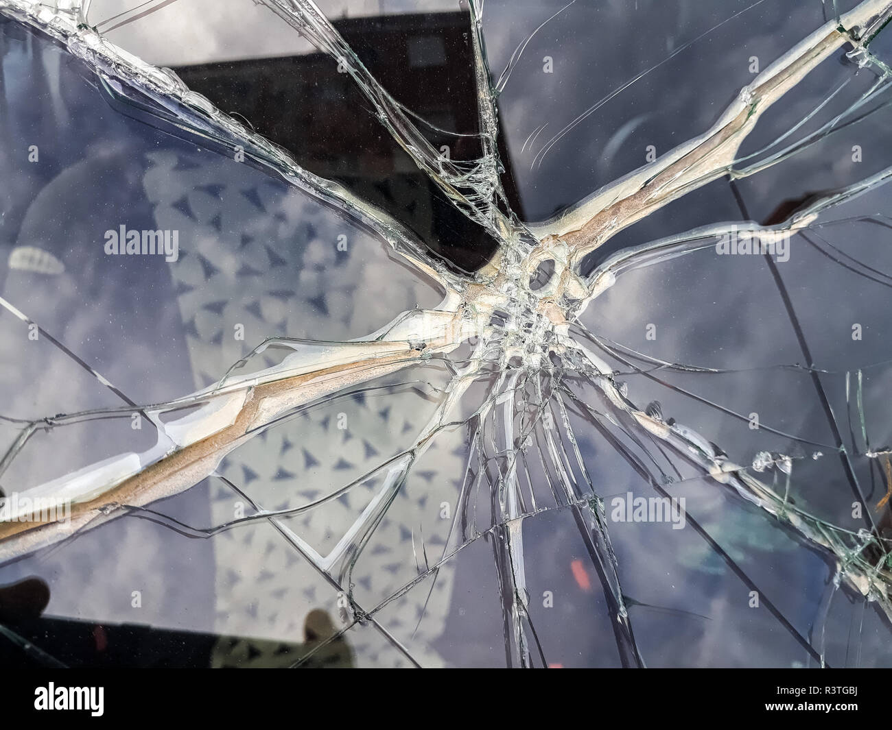 Broken windshield of abandoned and destroyed car, with broken glass ...