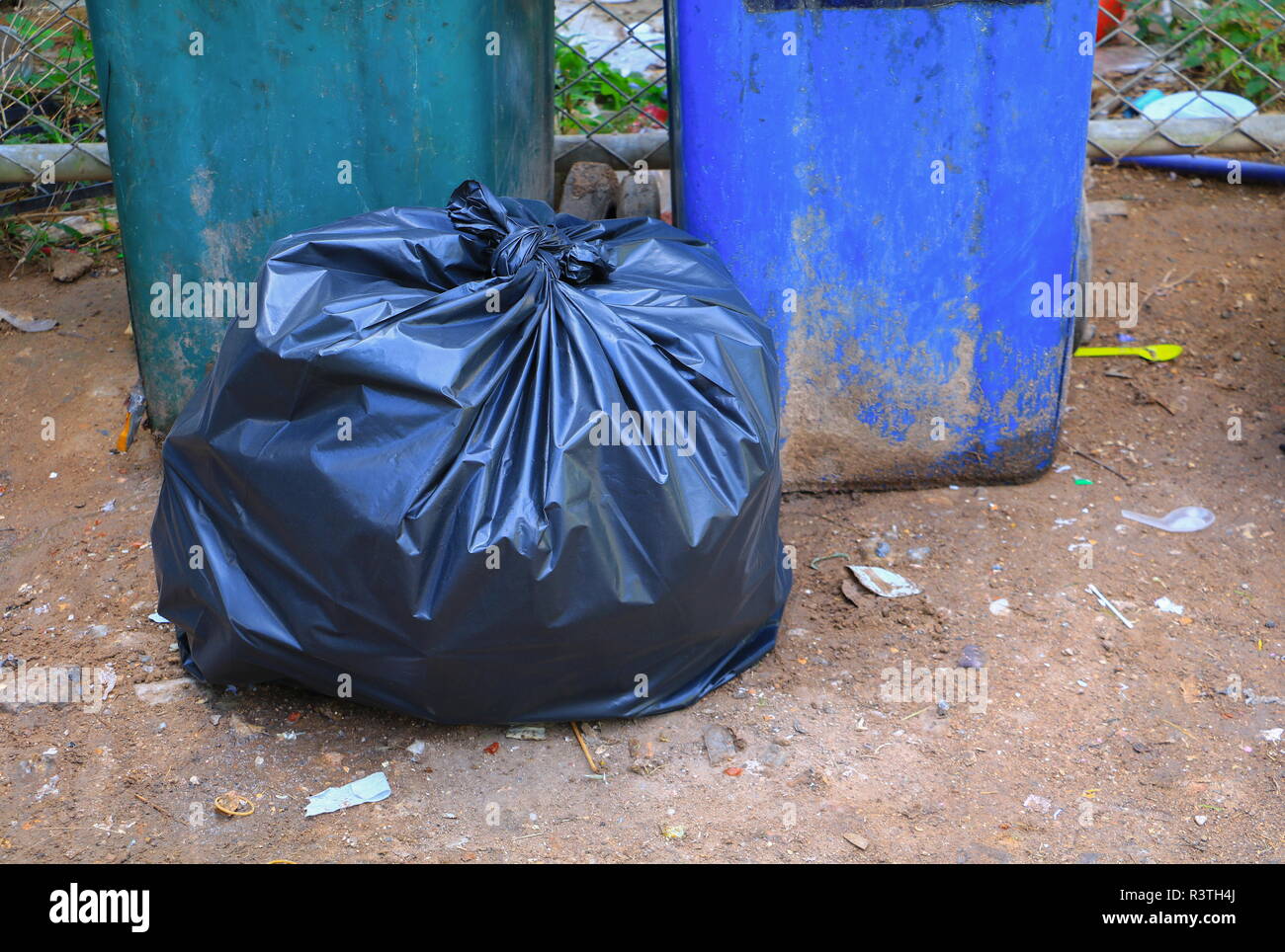 Pile black garbage bag roadside in the city close up Stock Photo - Alamy