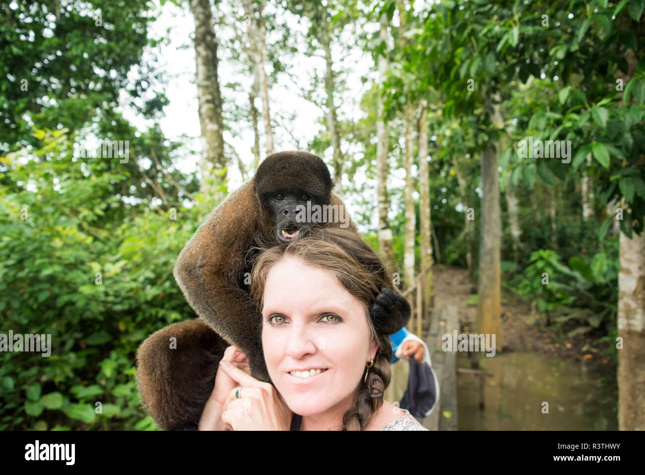 Woolly Monkey and Woman Stock Photo - Alamy