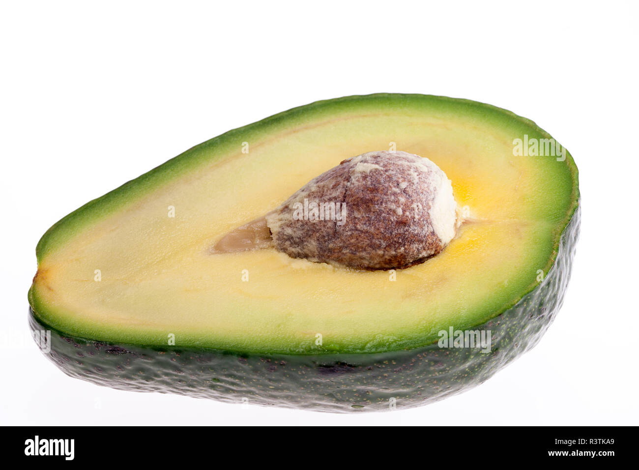 half of cut avocado isolated on white background Stock Photo - Alamy
