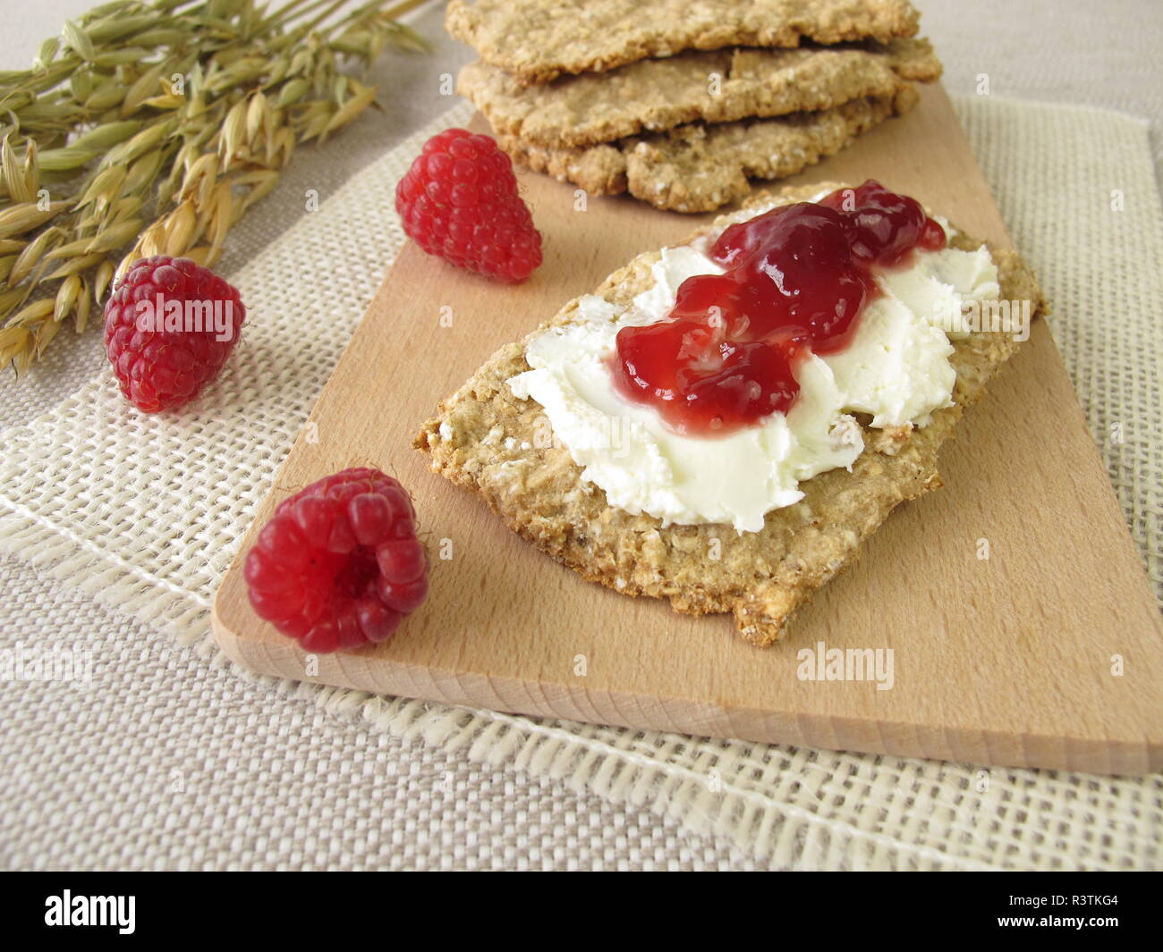 homemade oat crispbread with raspberry jam Stock Photo - Alamy