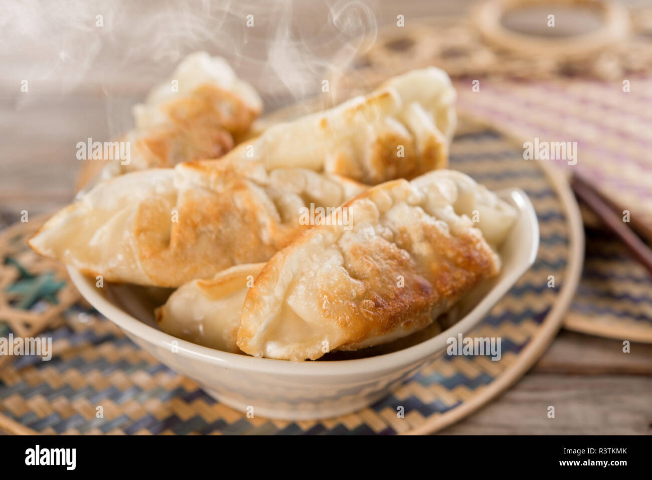 Famous Asian gourmet pan fried dumplings Stock Photo - Alamy