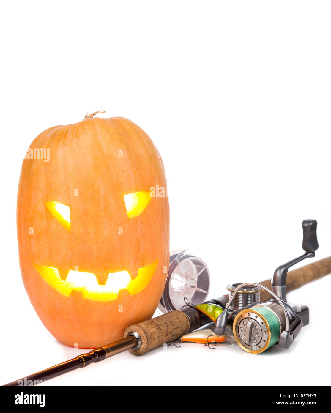 halloween pumpkin with fishing tackles on white Stock Photo - Alamy