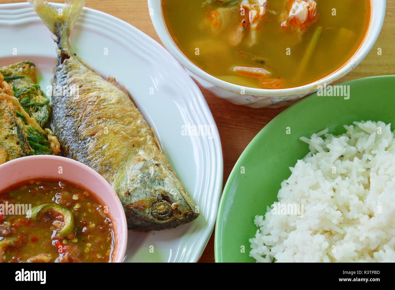 Thai food set and plain rice on table Stock Photo - Alamy