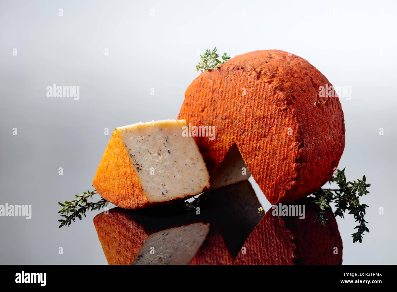 Red Pecorino sheep milk cheese with thyme and pepper. Traditional sheep ...