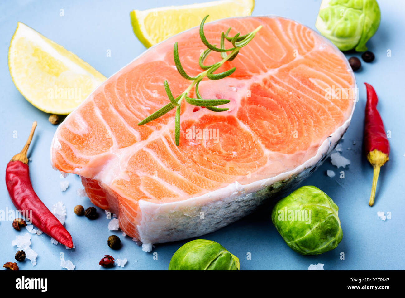 Raw salmon steak with spice on plate.Raw fish Stock Photo - Alamy