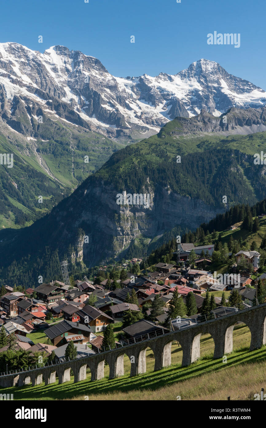 Switzerland. Funicular trestle rises above the village of Murren in the ...