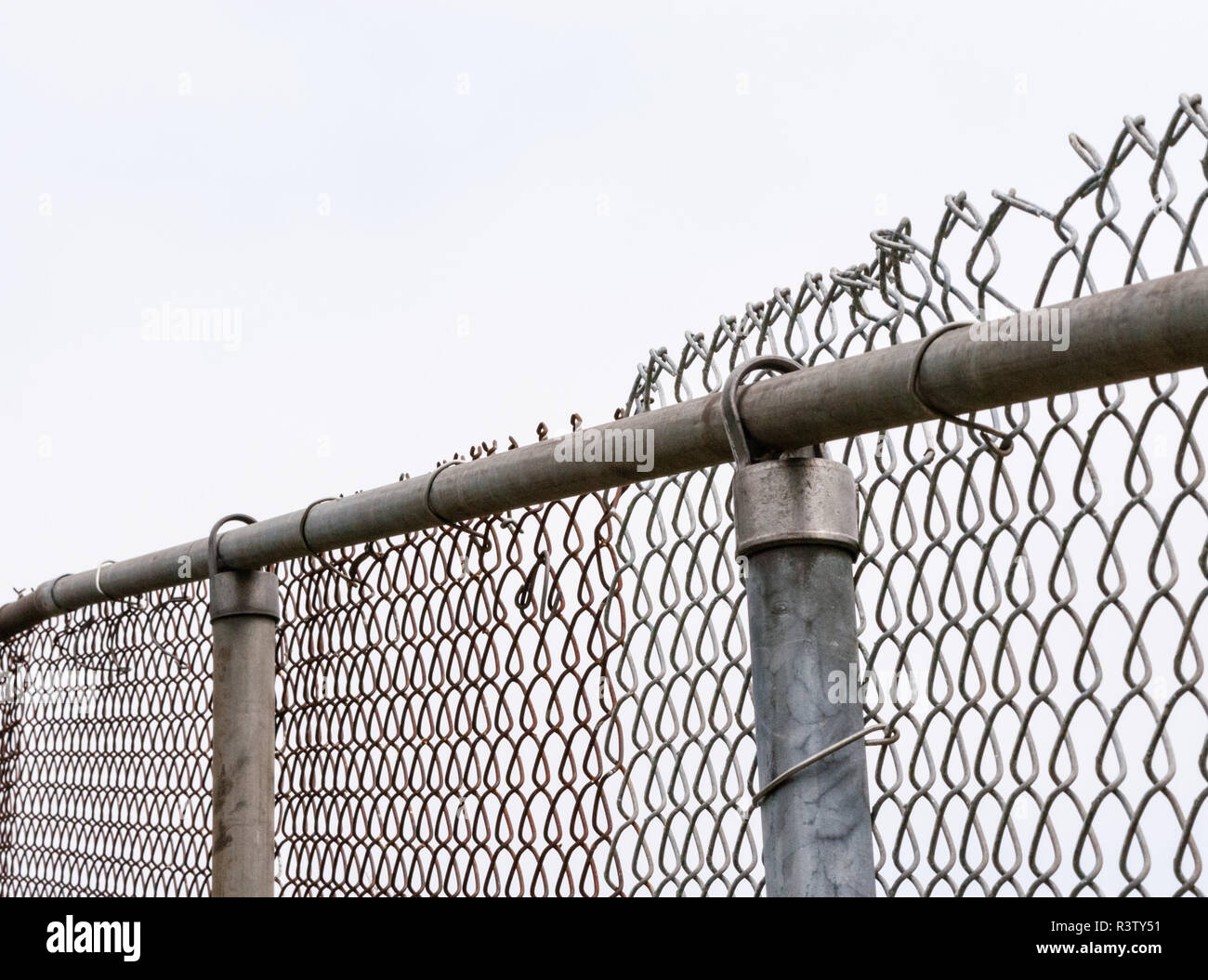 Top of old chain-link fence and posts on white Stock Photo - Alamy