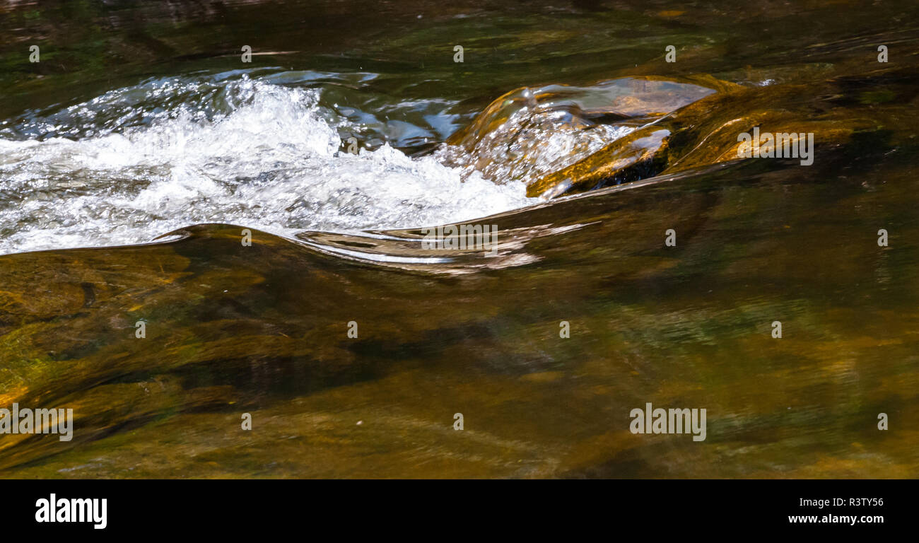 Abstract smooth and splashing river water Stock Photo - Alamy