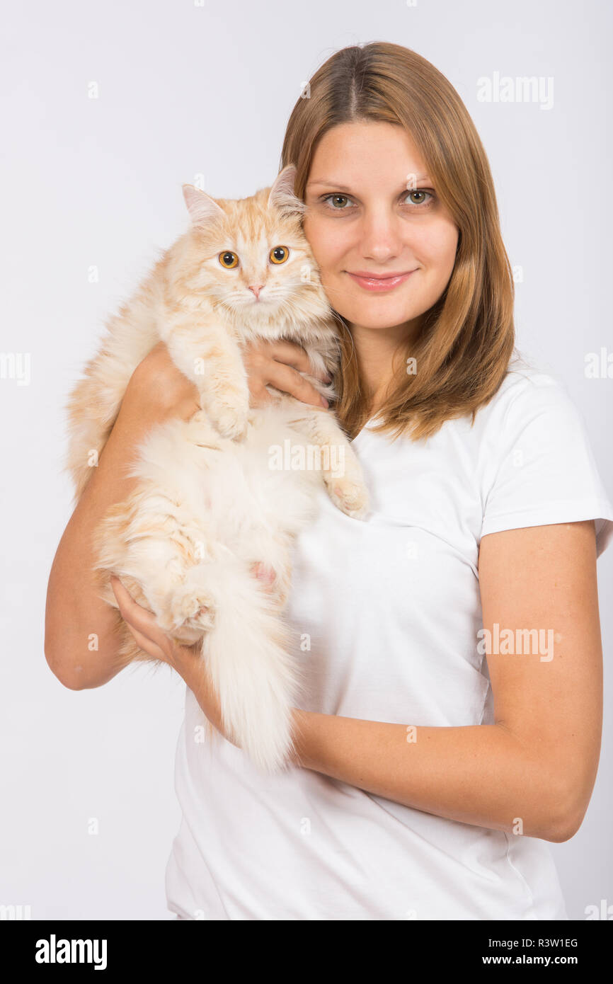 Girl hugging domestic cat Stock Photo - Alamy