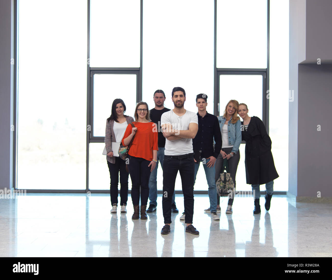 students group standing together as team Stock Photo - Alamy