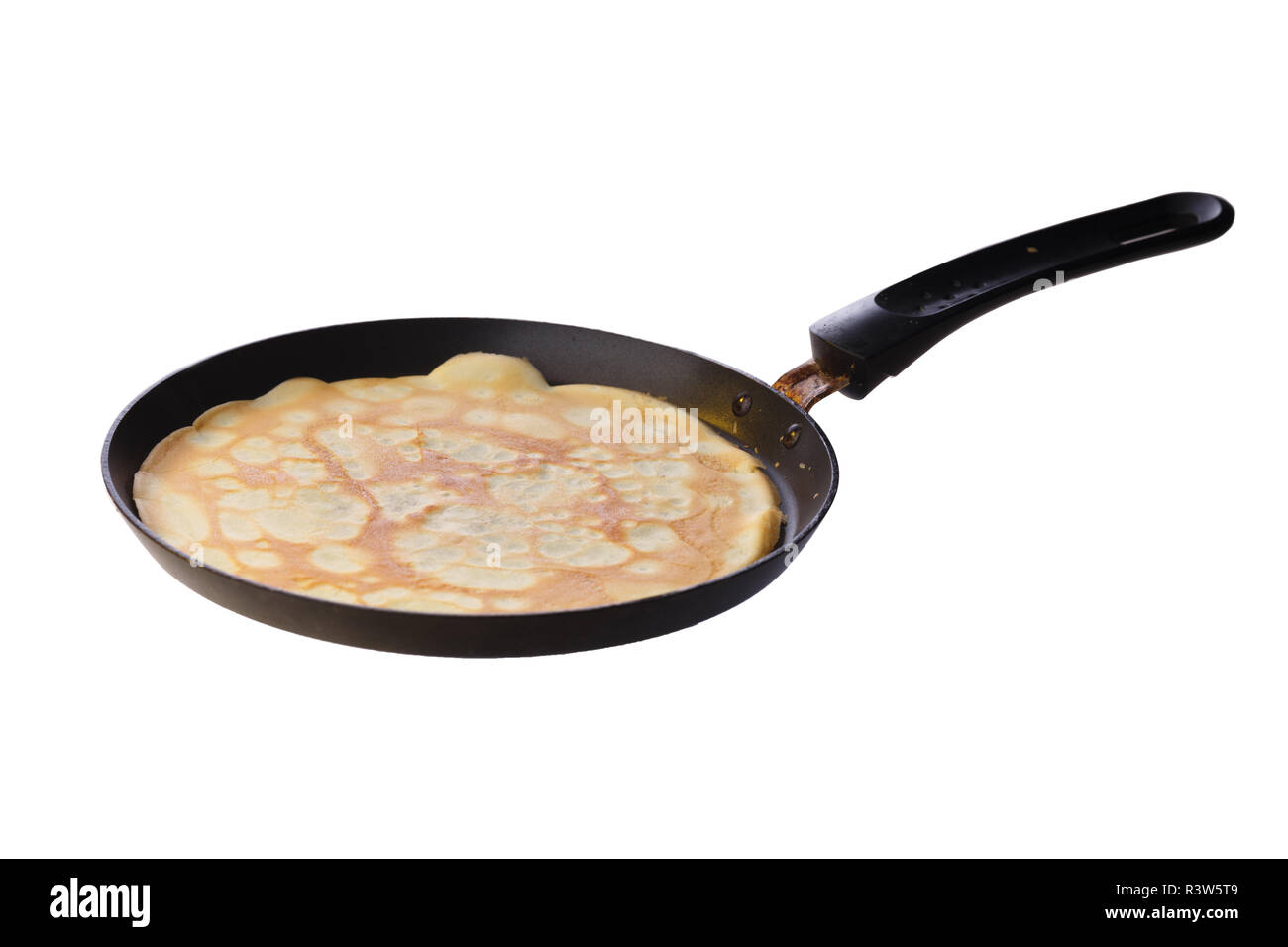 Baking a crepe Stock Photo - Alamy