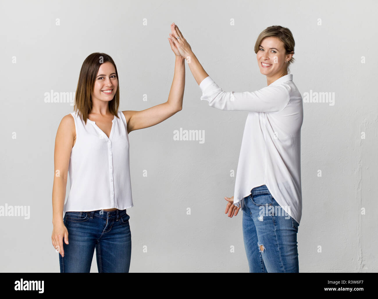 Two women greeting kiss hi-res stock photography and images - Alamy
