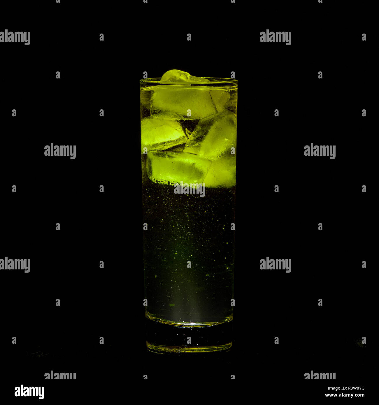 Fruity Yellow Sparkling iced alcohol drink with isolated black ...