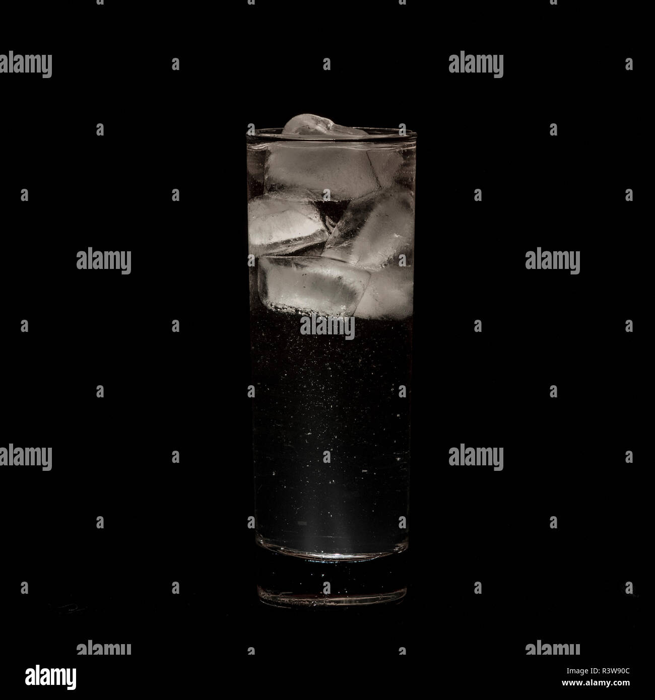 Sparkling full iced alcohol drink with isolated black background Stock ...