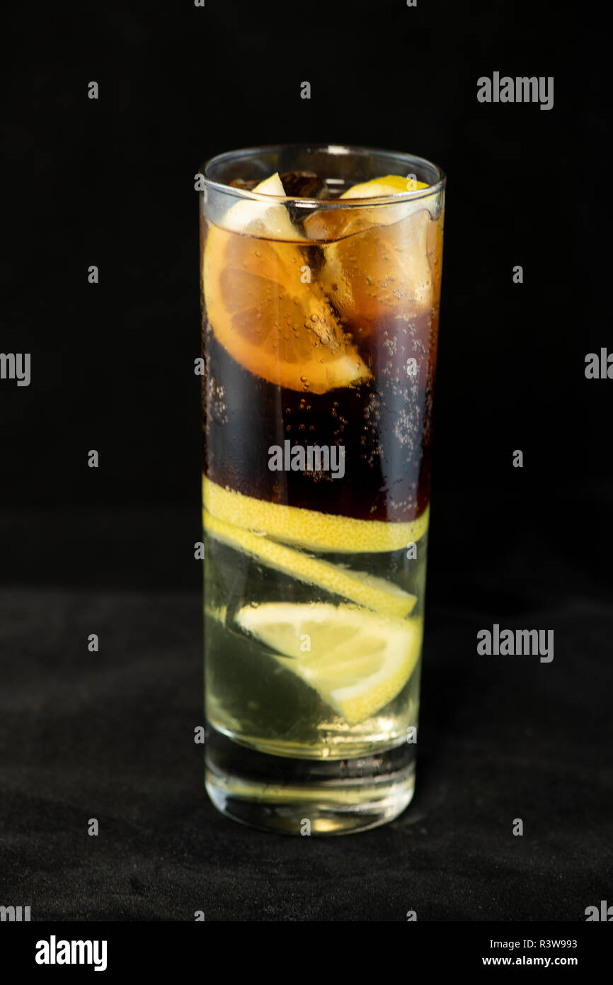 Cuba Libre cocktail with rum, coke and lime juice with lime wedge and ...