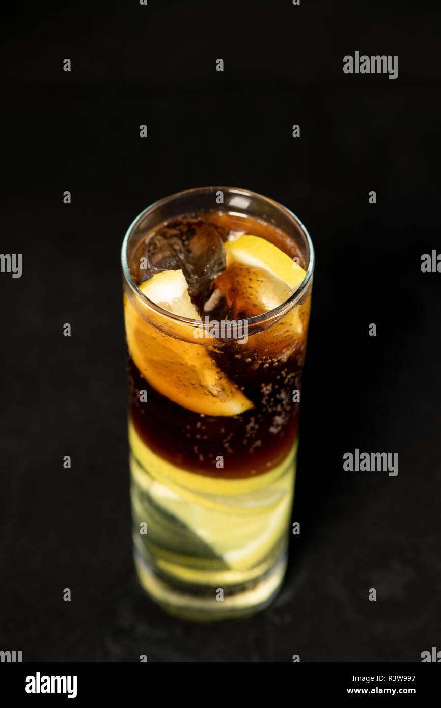 Cuba Libre cocktail with rum, coke and lime juice with lime wedge and ...