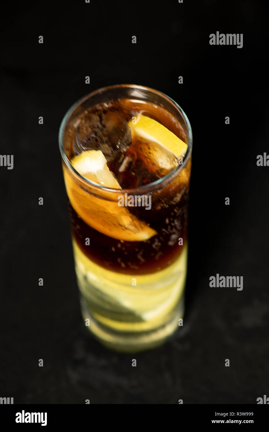 Cuba Libre cocktail with rum, coke and lime juice with lime wedge and ...