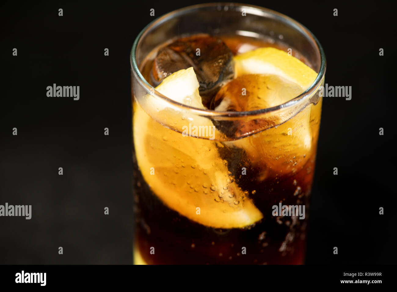 Cuba Libre cocktail with rum, coke and lime juice with lime wedge and ...
