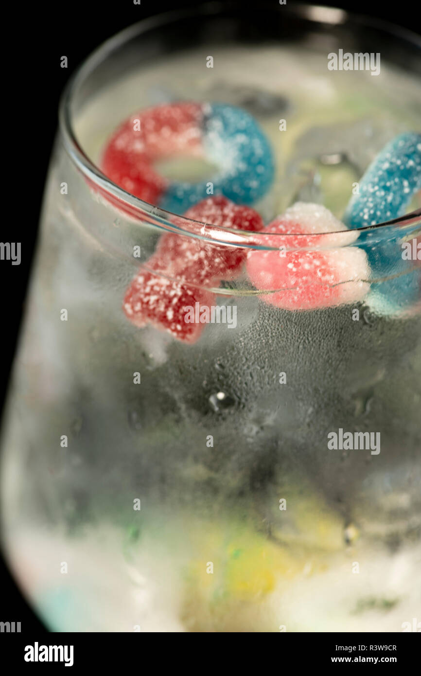 Gin and Tonic with jelly beans with isolated black background Stock ...