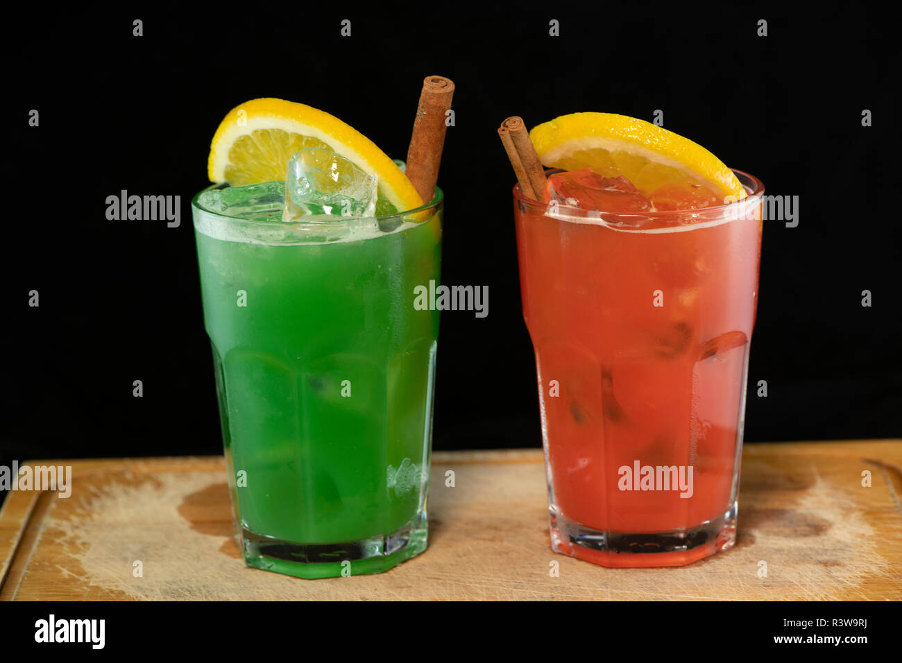 Red and Green Cocktails with red and green juices, alcohol and lime ...