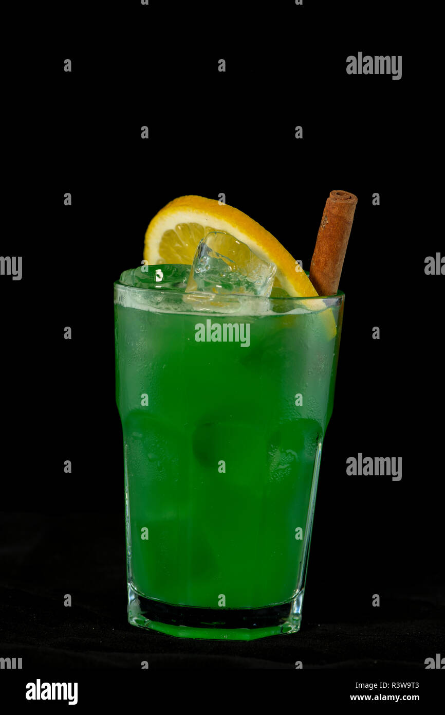 Green Cocktail with green juices, alcohol and lime wedge with isolated ...