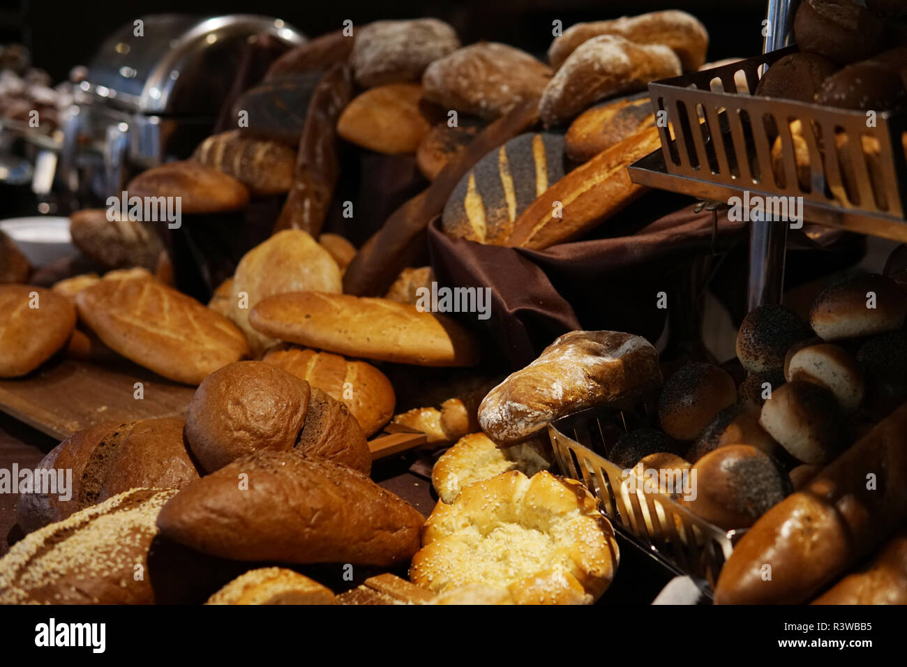 different bread rolls on table bakeries Stock Photo - Alamy