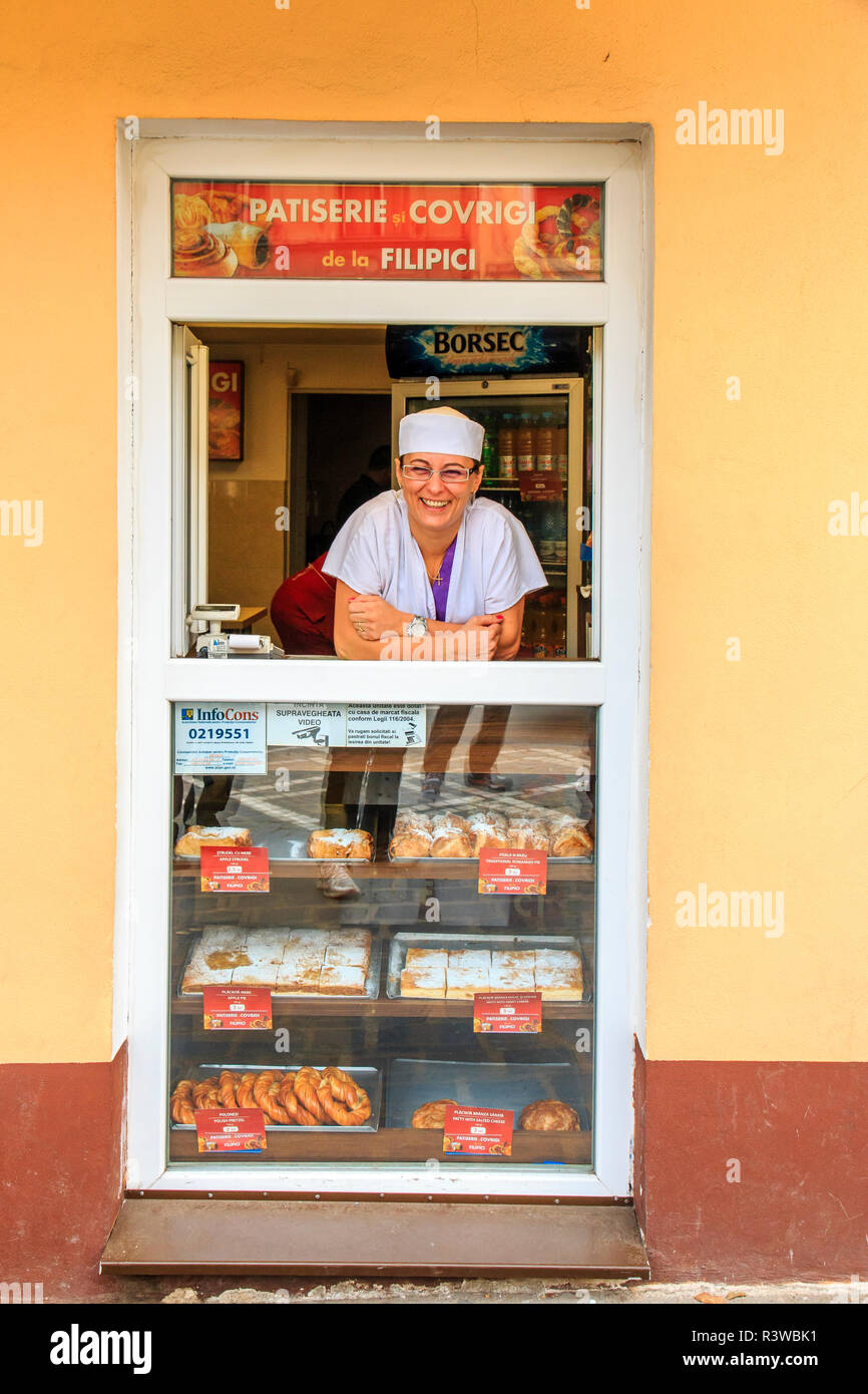 Romania, Brasov, near Council Square. Bakery take-out window ...