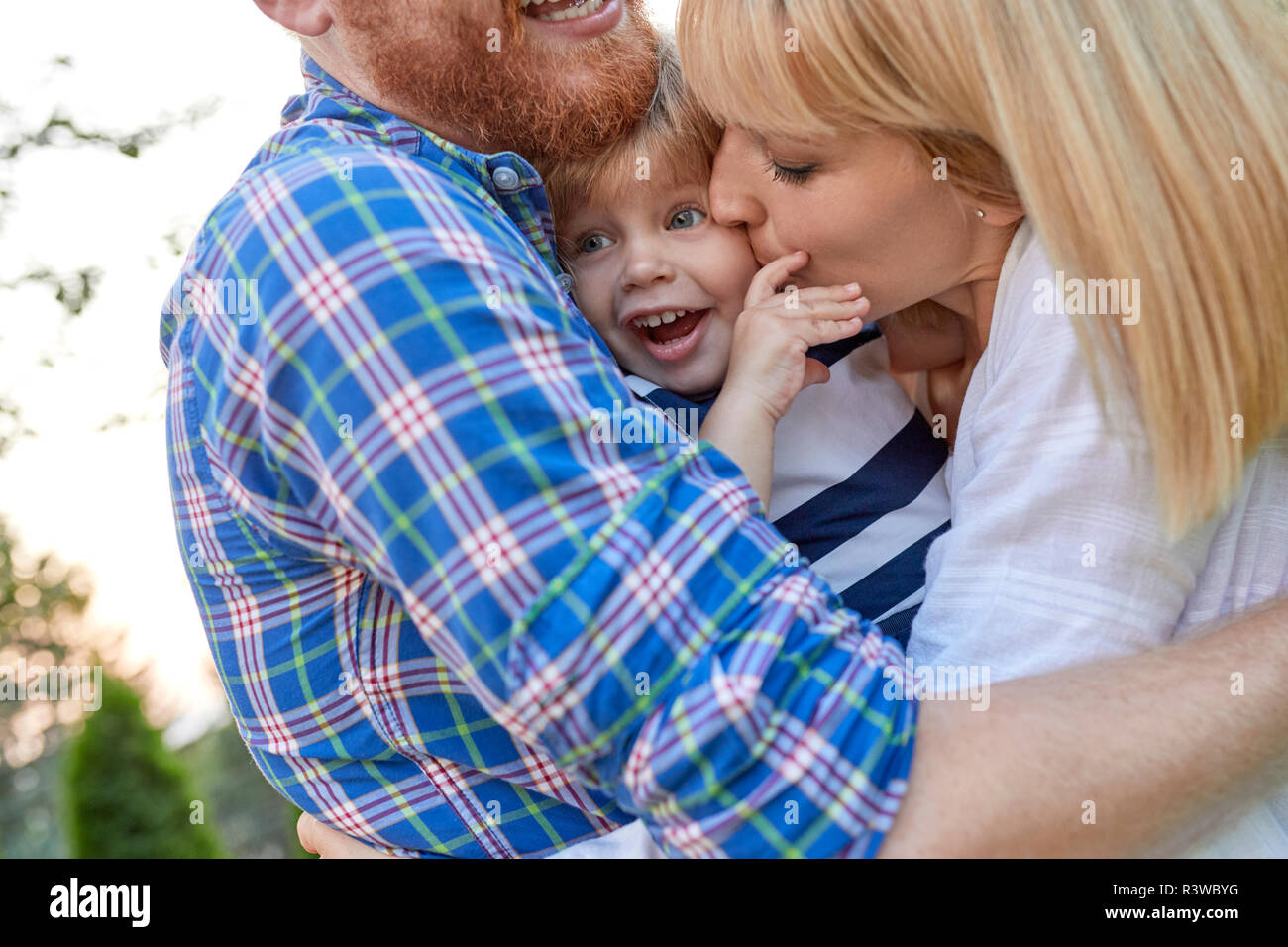 Daughter hugging her parents hi-res stock photography and images - Alamy