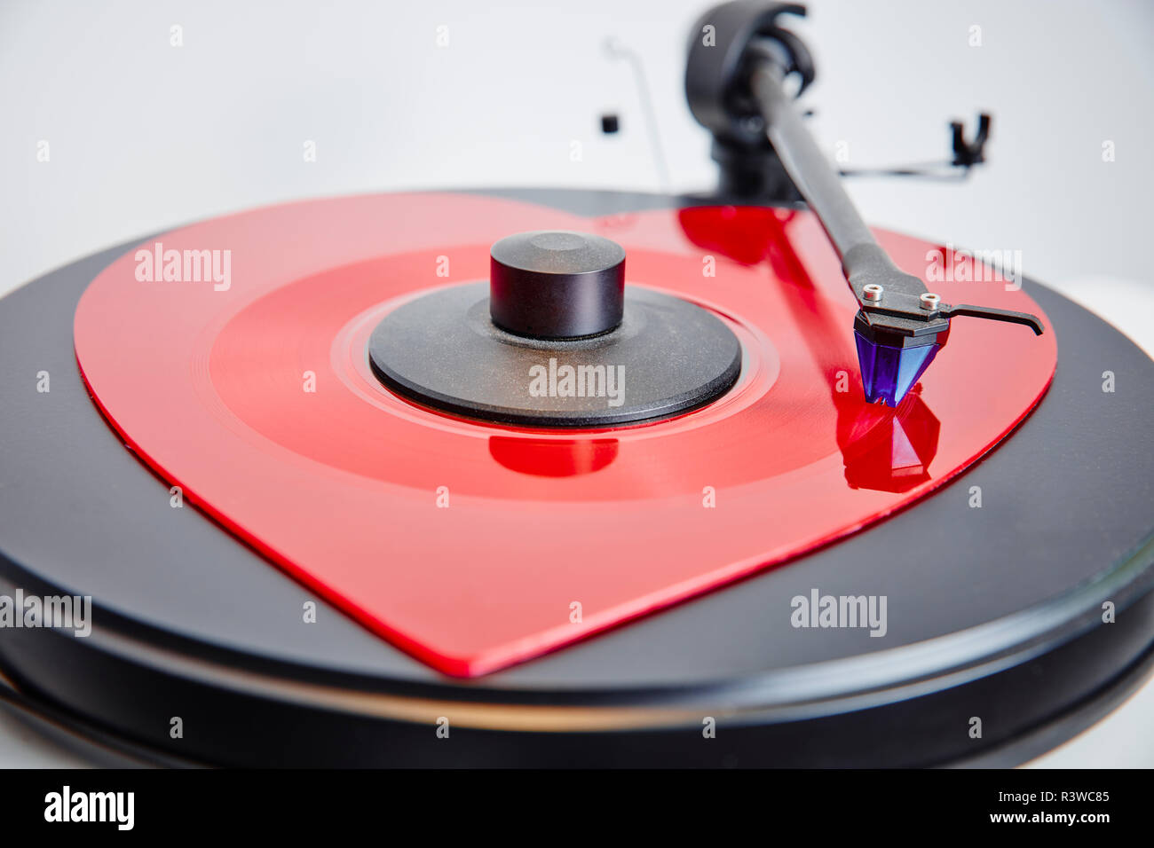 Heart-shaped vinyl record on record player Stock Photo - Alamy