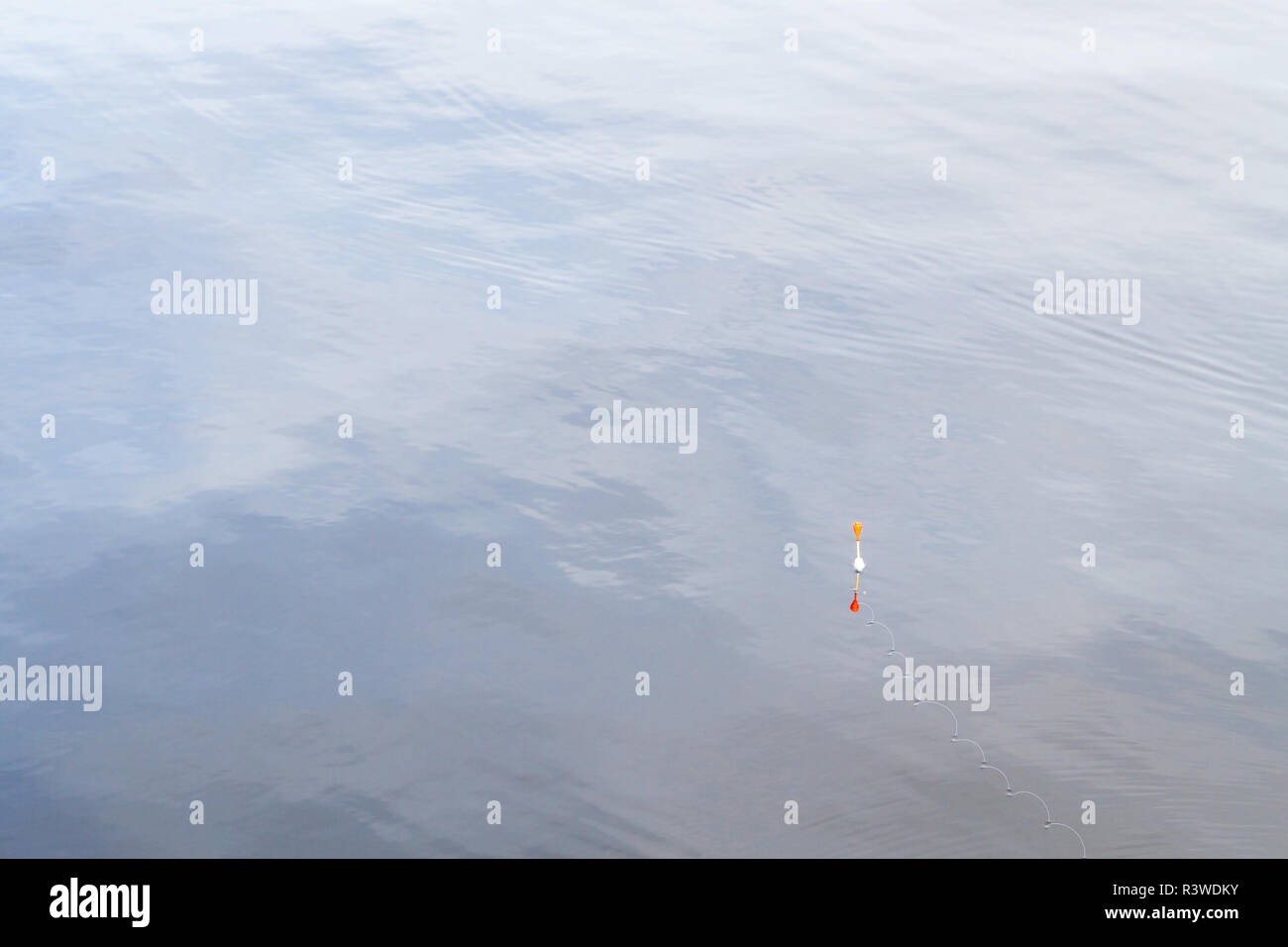 The surface of the water with a float in the summer Stock Photo - Alamy