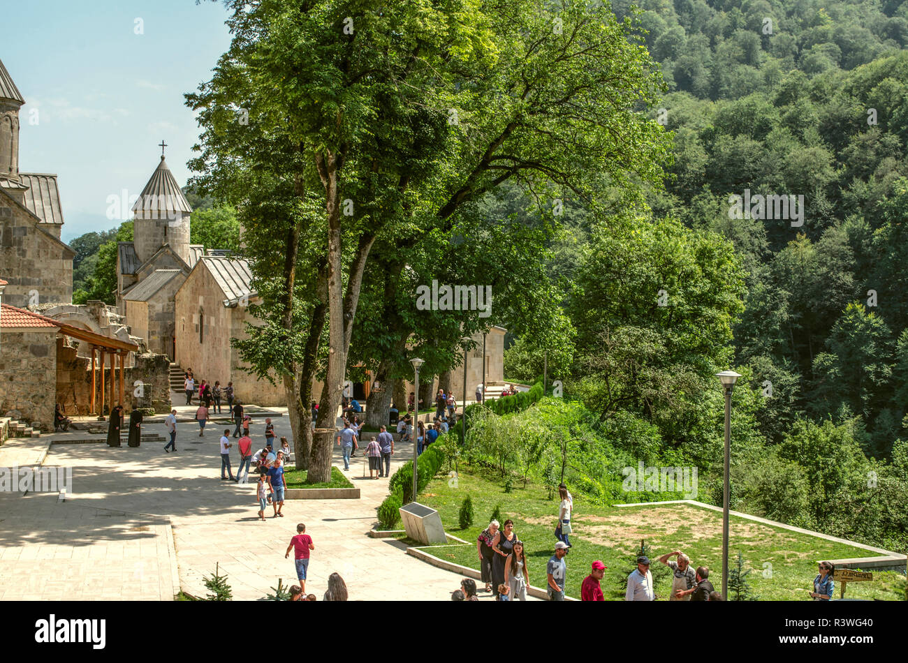 Dilijan, Armenia, August 24, 2018: Courtyard with large trees in front ...