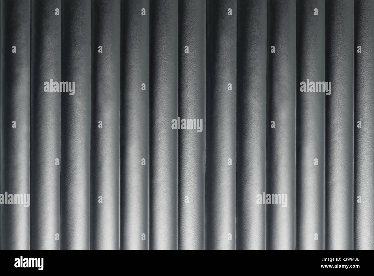 Abstract silver background with vertical lines, lit with a soft light ...