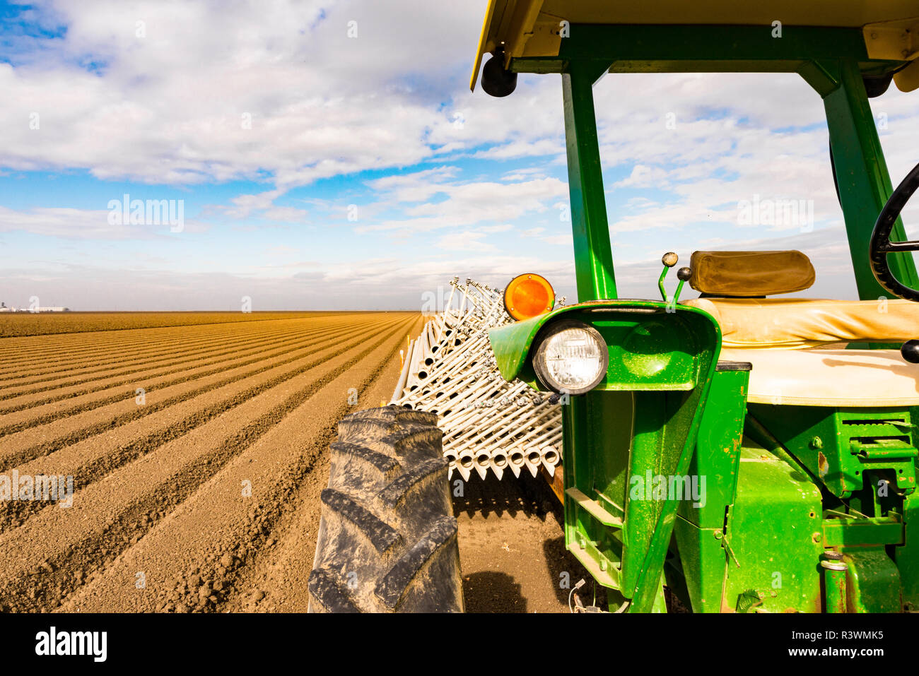 USA, California, Central Valley. Close-up of tractor with drought ...