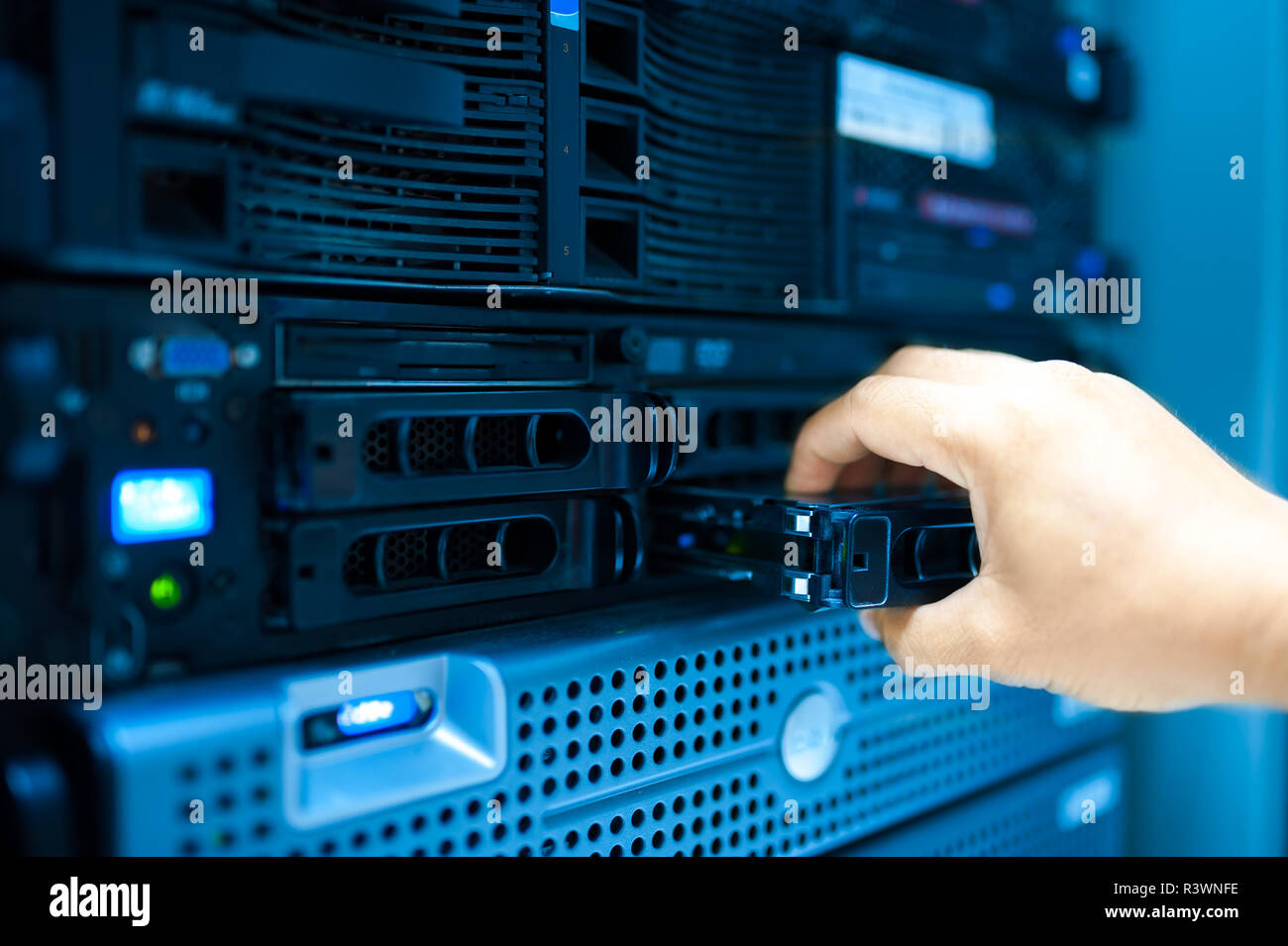 Man fix server network in data center room Stock Photo - Alamy