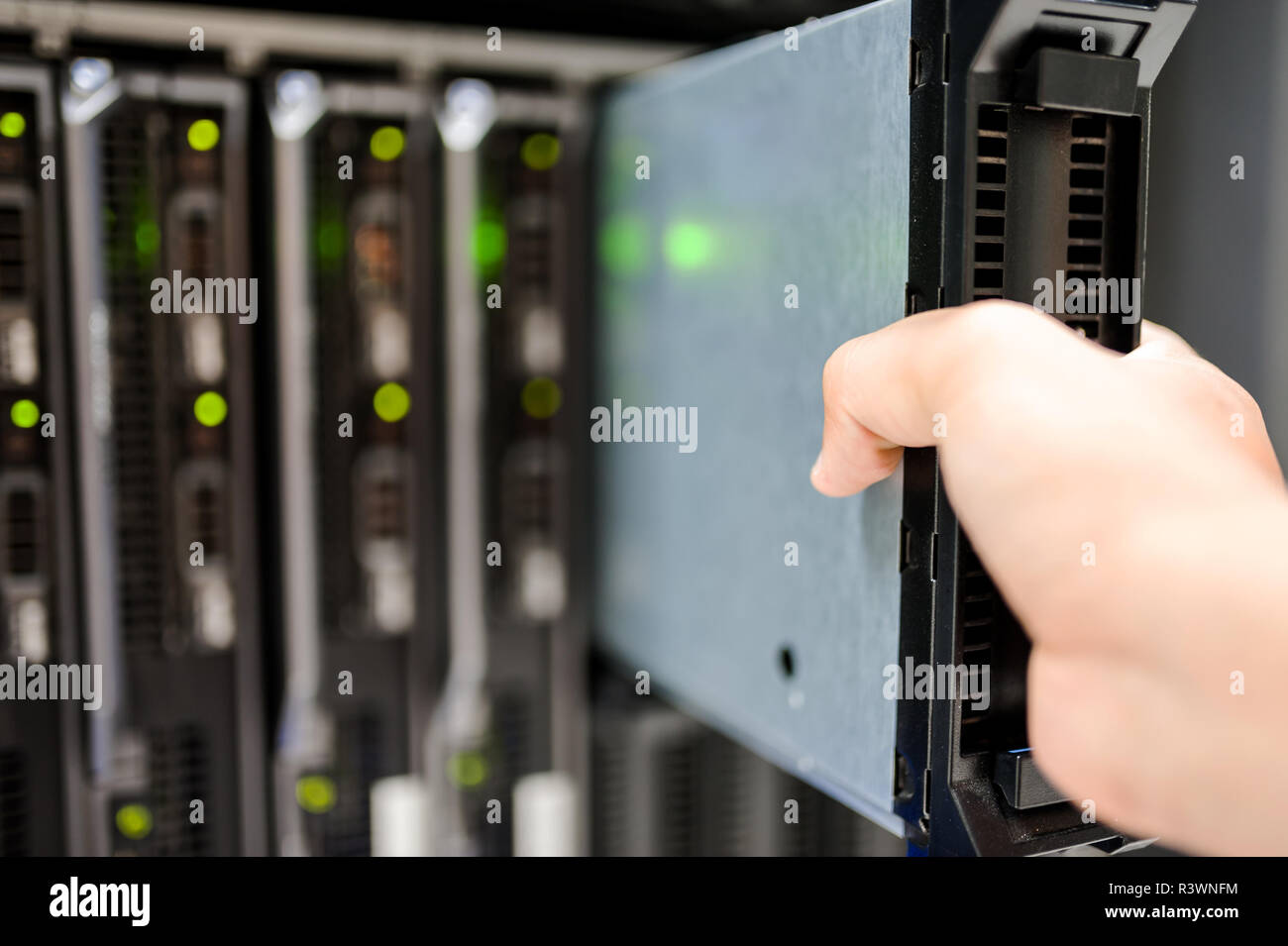 Man fix server network in data center room Stock Photo - Alamy