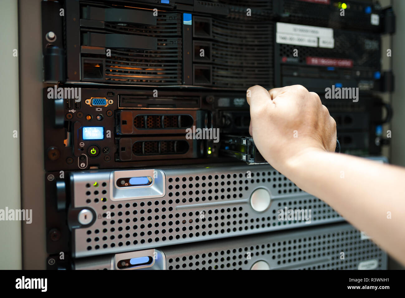 Man fix server network in data center room Stock Photo - Alamy