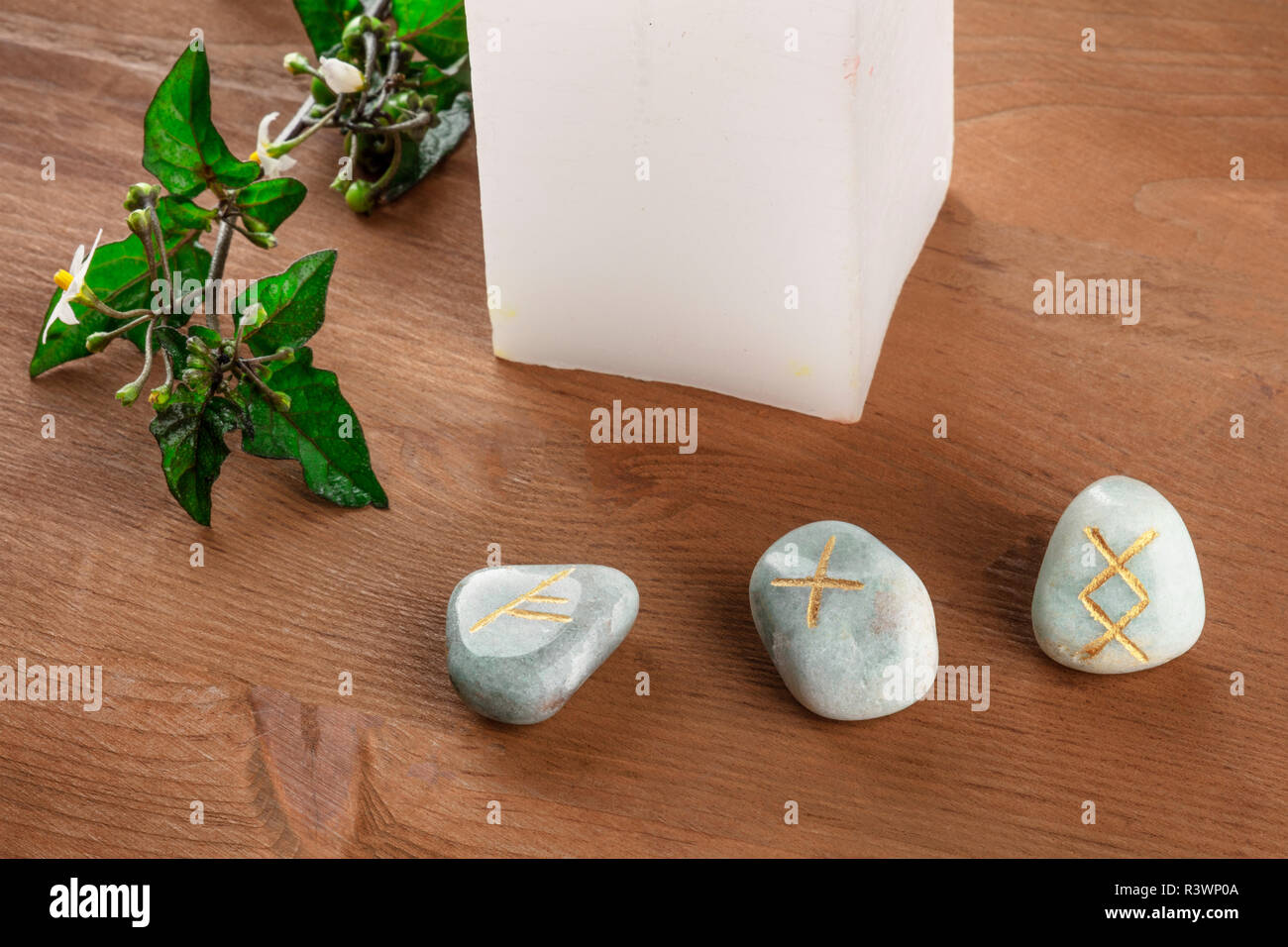 A closeup photo of Norse runes, stones with symbols used in Wicca and ...