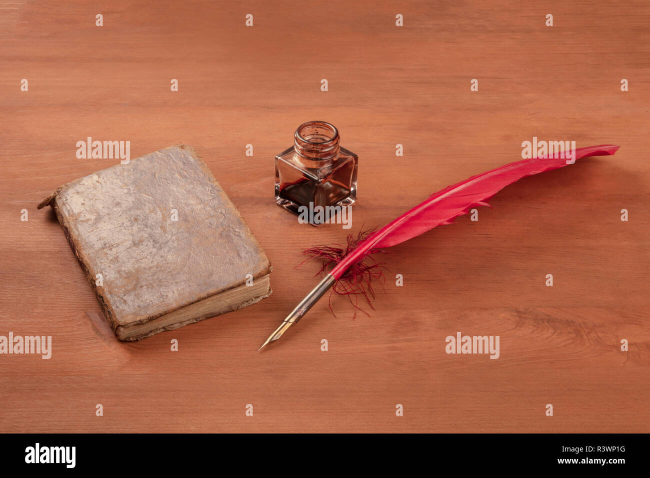 Writing Poetry. A photo of a quill with and ink well and an old book on ...