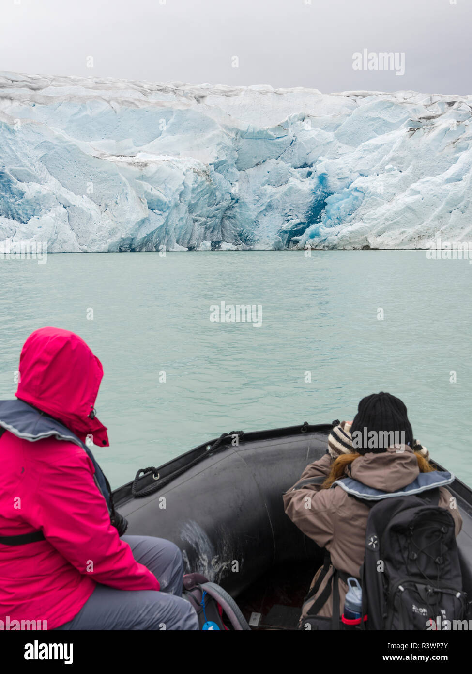 Tourists near the glaciers in the Qalerallit Imaa Fjord. Southern ...