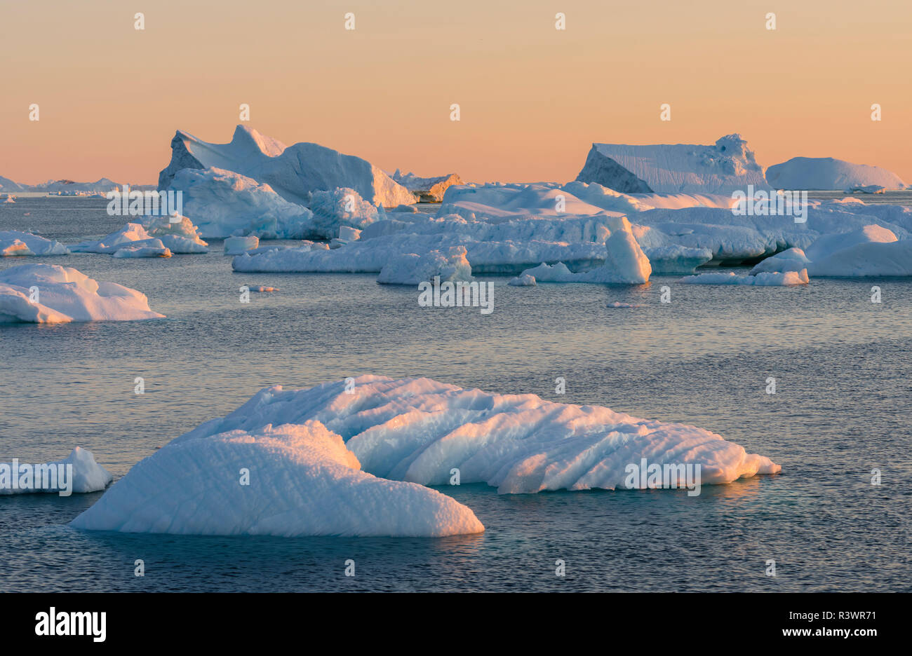 Icebergs in Disko Bay. Inuit village Oqaatsut (once called Rodebay ...