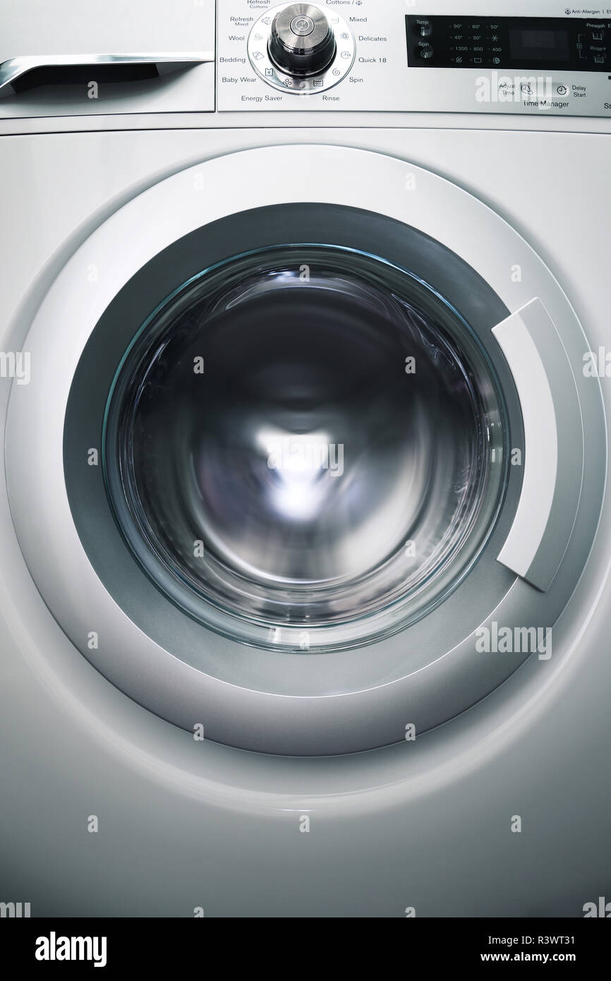 Loading washing machine hi-res stock photography and images - Alamy