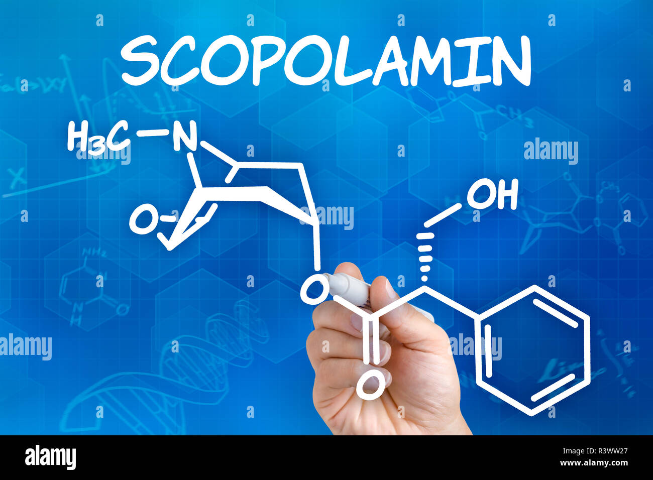 hand with pencil draws chemical structural formula of scopolamine Stock ...