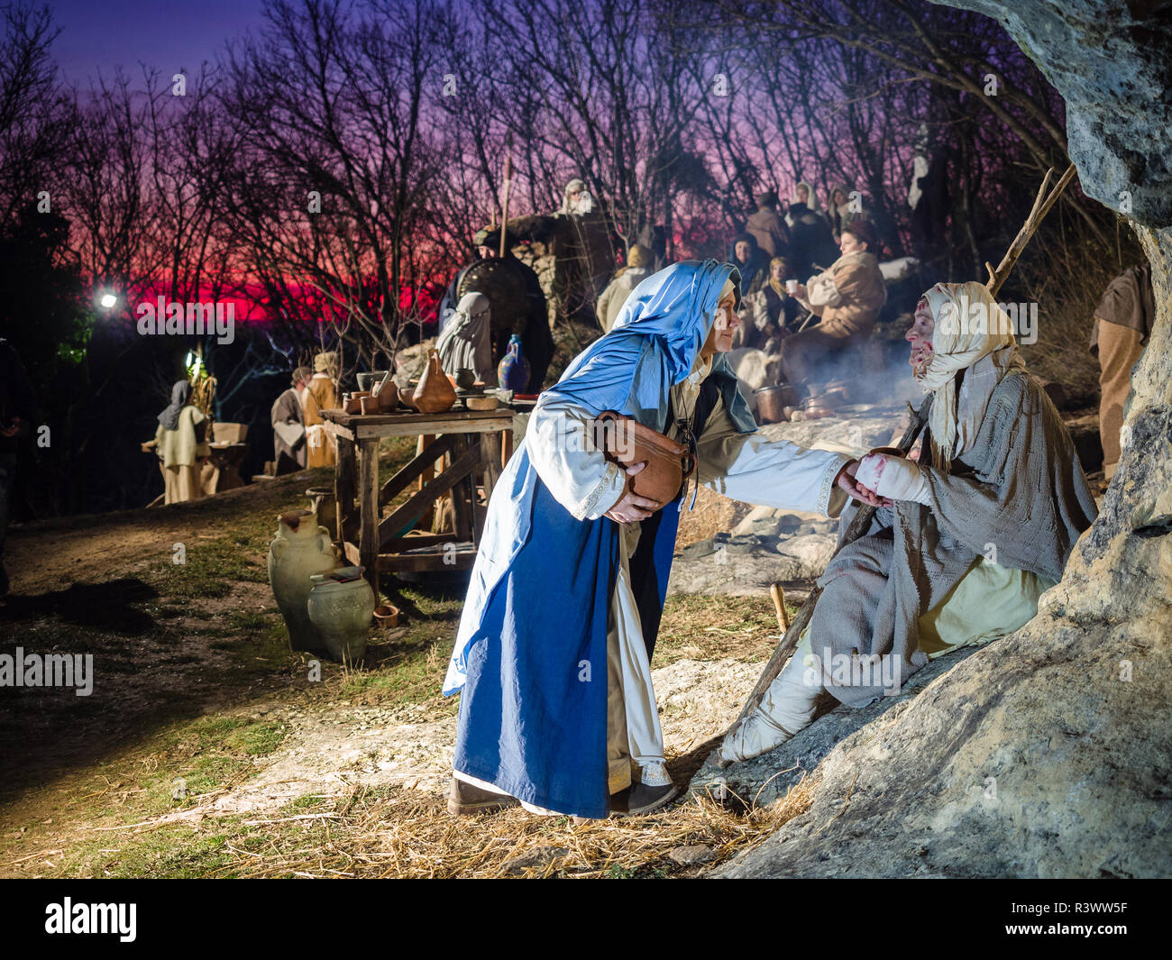 Villaga, Italy - December 30, 2017: Woman helps a leprous beggar during ...