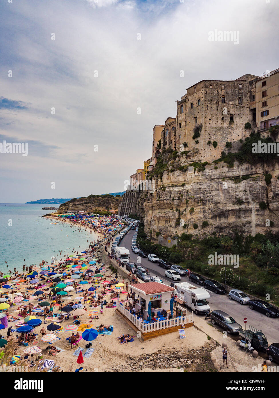 Panorama of Tropea, Italy and beach crowded with sunbathers Stock Photo ...