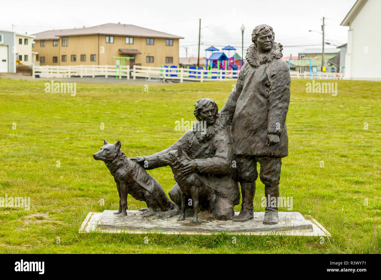 USA, Alaska, Nome. Statue of Eskimo boys in Anvil City Square Stock ...